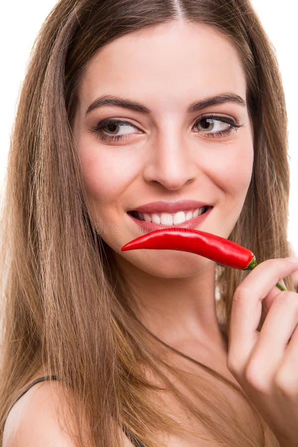 Woman eating pepper stock photo. Image of diet, cayenne - 45850374