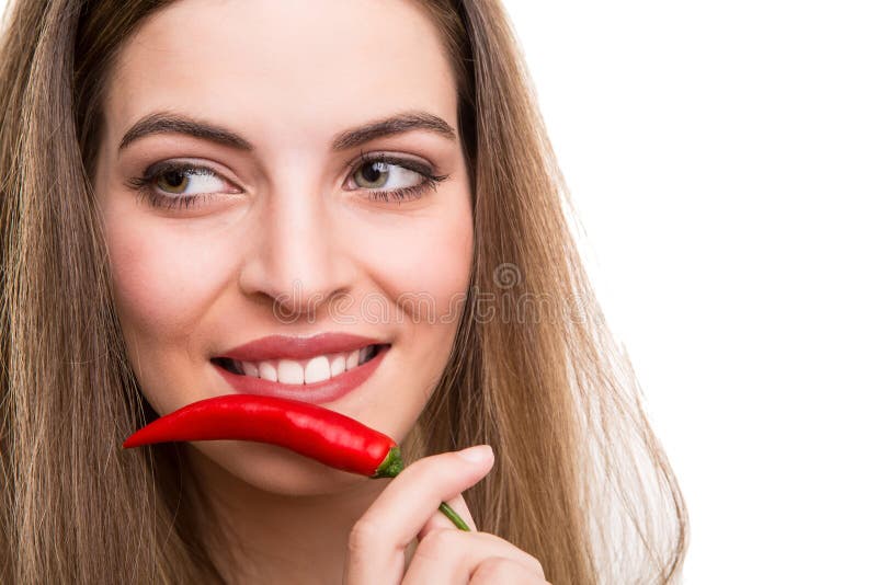 Woman eating pepper stock image. Image of metabolism - 45850437