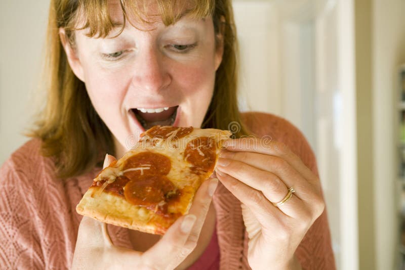 Woman Eating Pepperoni Pizza Stock Image - Image of heat, diet: 1332083