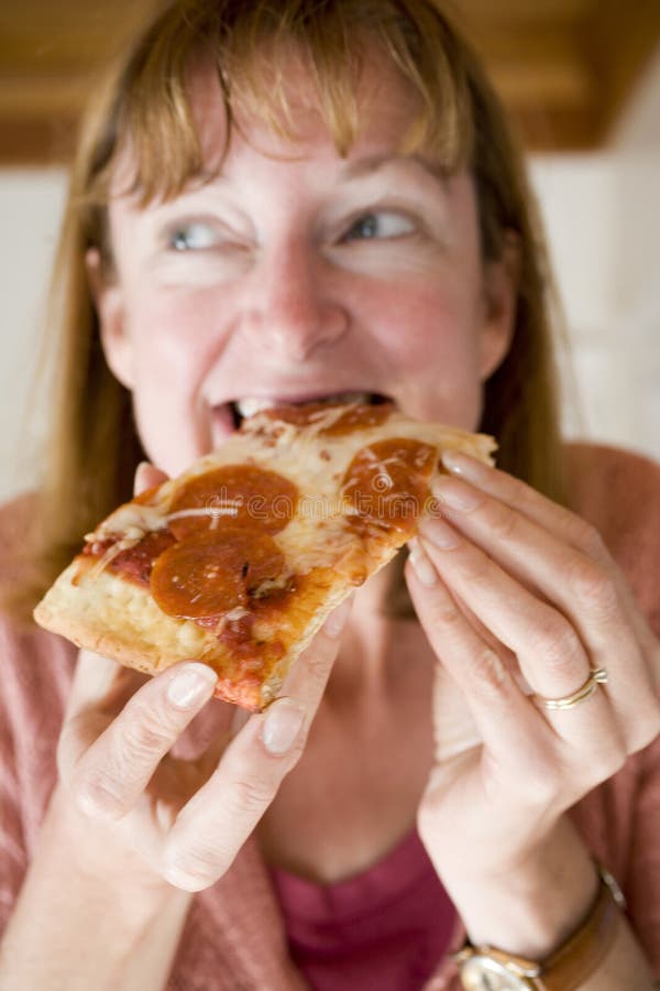 Woman Eating Pepperoni Pizza Stock Image - Image of cold, bite: 1332087