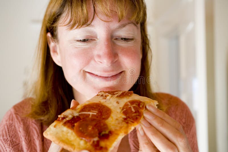 Man Eating Pepperoni Pizza stock photo. Image of hungry - 1323710