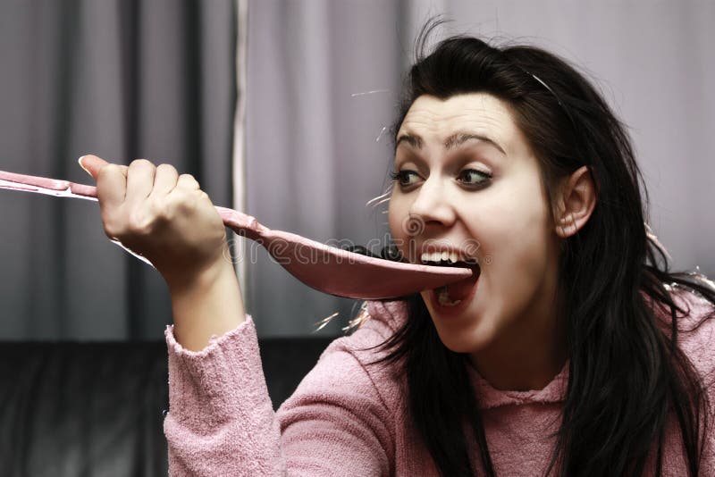 Woman Eating with a Pink Giant Spoon Stock Image - Image of sized ...