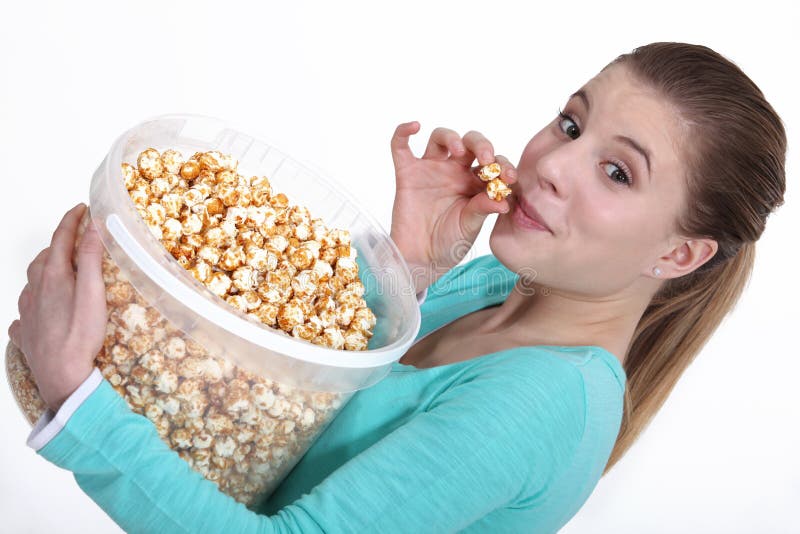 Woman eating popcorn stock photo. Image of bowl, eating - 29878824