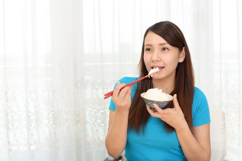 Woman eating rice stock image. Image of japanese, bowl - 145445751