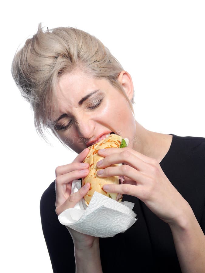 Woman eating a sandwich stock photo. Image of style, model - 82139806