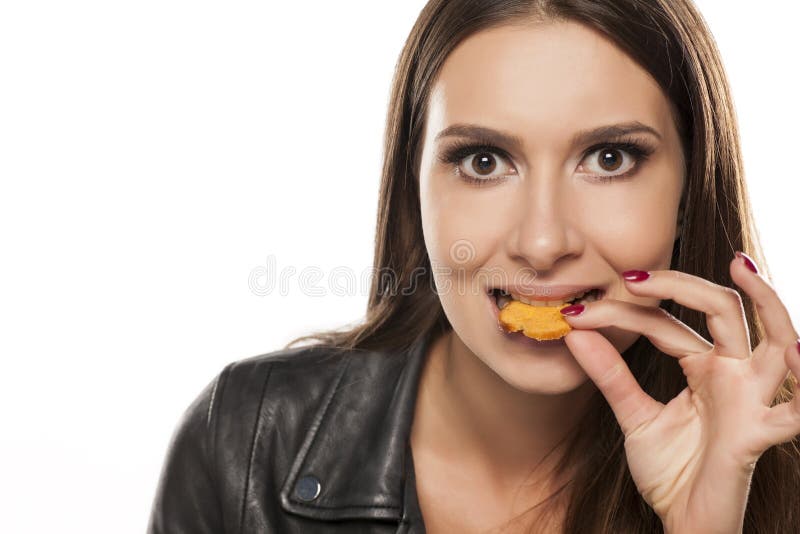 Woman eating snacks stock image. Image of beautiful, snack - 82584365