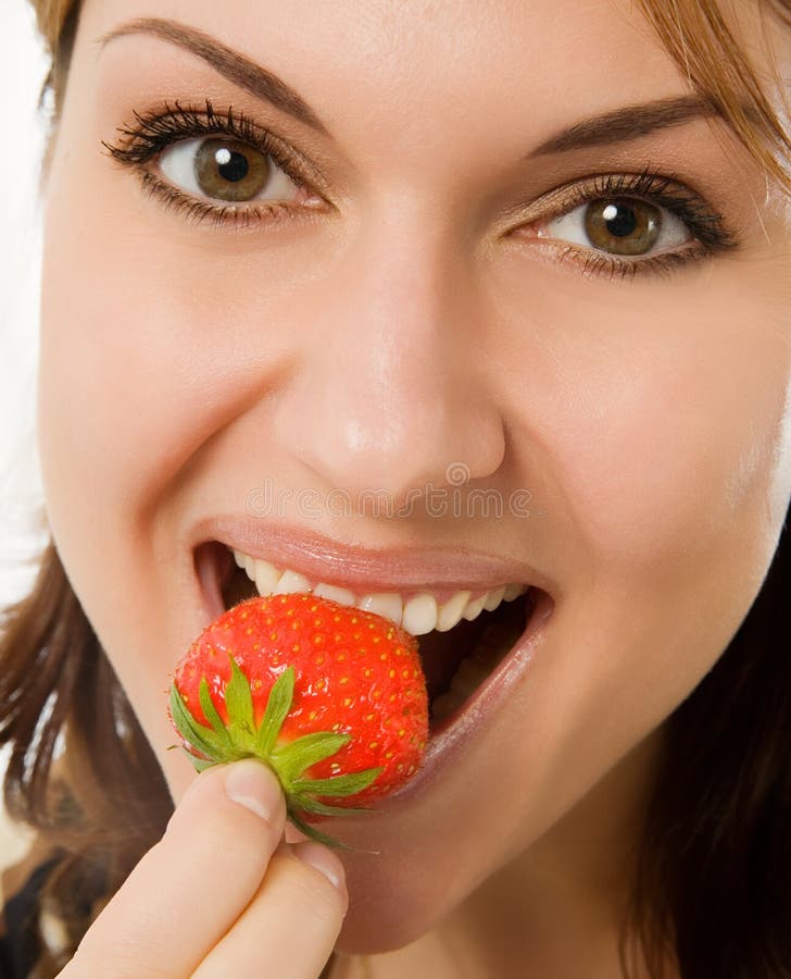Girl eating a strawberry stock image. Image of adults - 5307599