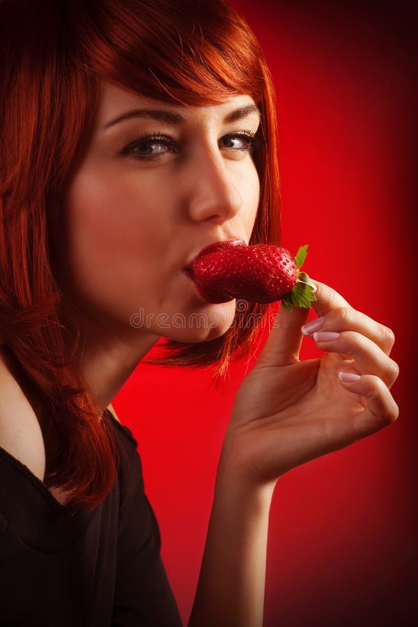 Woman eating strawberry stock photo. Image of fresh, hand - 29121004