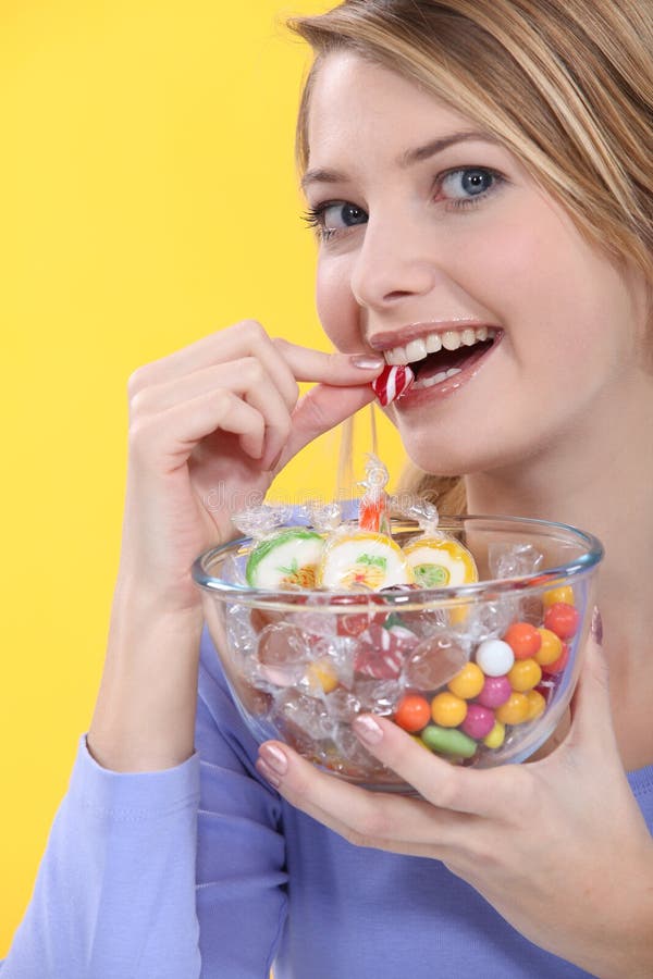 Woman eating sweets stock image. Image of fruitdrop, suck - 28192945