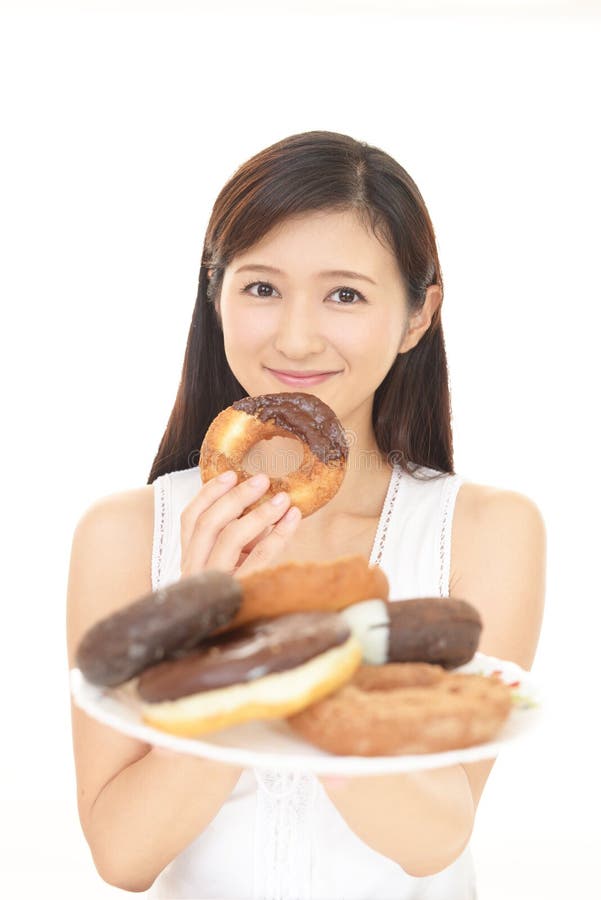 Woman eating sweets stock photo. Image of health, doughnut - 92729162
