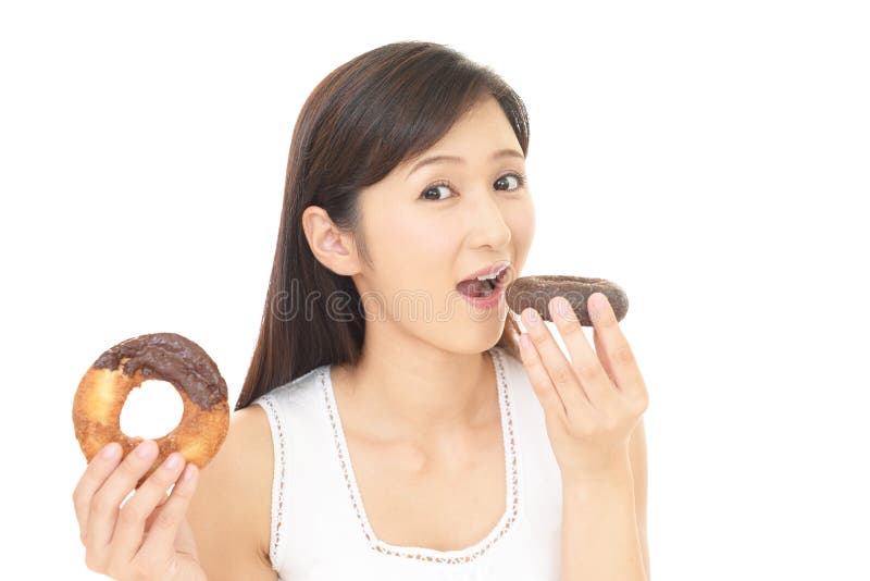 Woman eating sweets stock image. Image of appetite, hair - 92729173