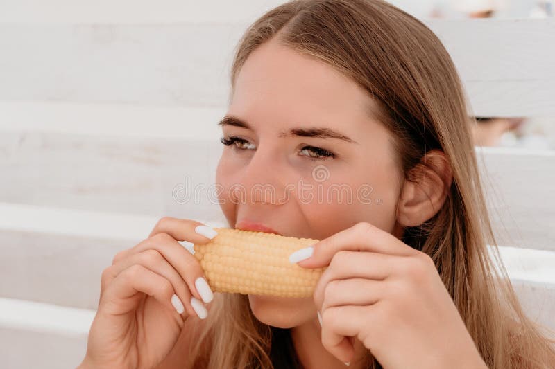 Woman Eats Corn On Beach Vegetarian Hipster Woman Eat Fresh Organic Grilled Corn Happy Lady On