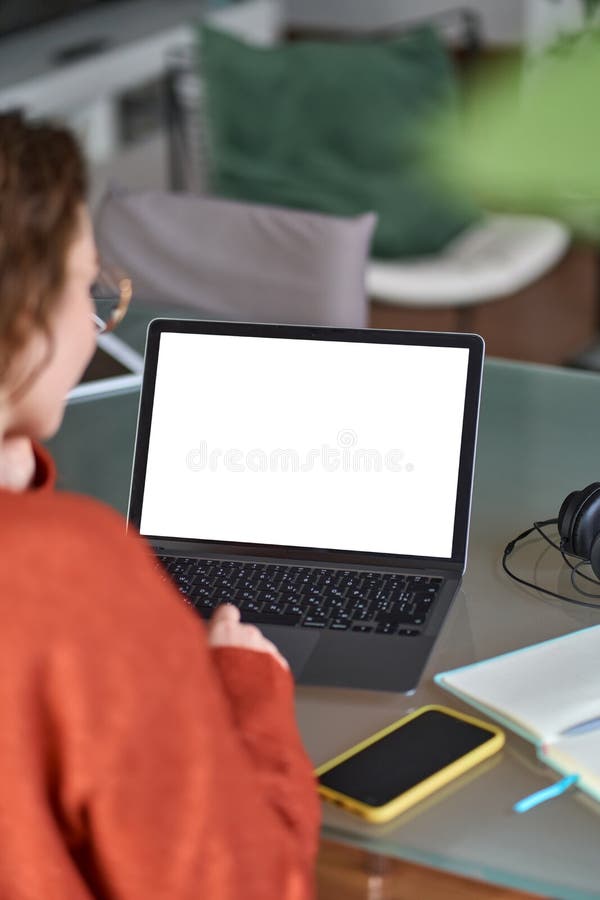 Woman Elearning Looking at Mock Up Screen Using Laptop, Over Shoulder ...