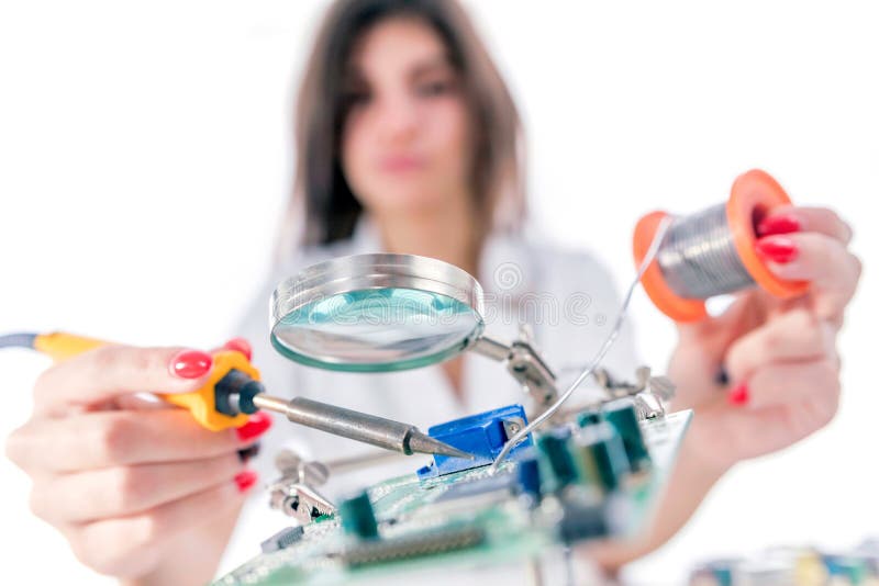 Woman Electronic Technician Repair Electronic Equipment Using Electric ...