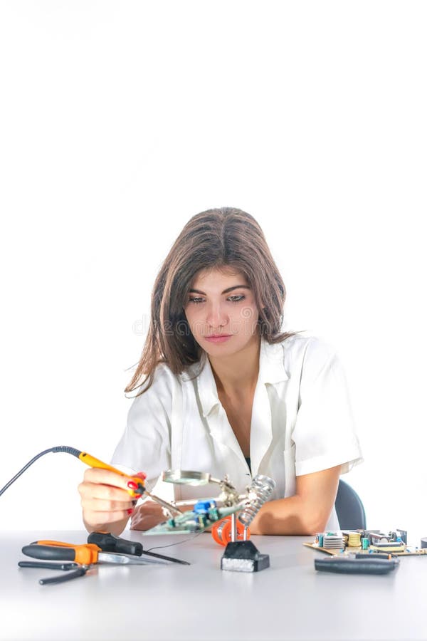 Woman Electronic Technician Repair Electronic Equipment Using Electric ...
