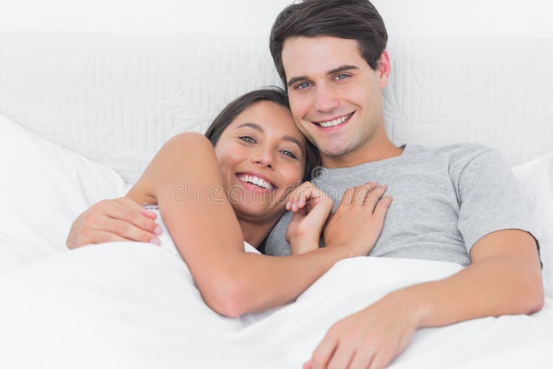 Woman Embracing Her Partner in Bed Stock Photo - Image of brunette ...