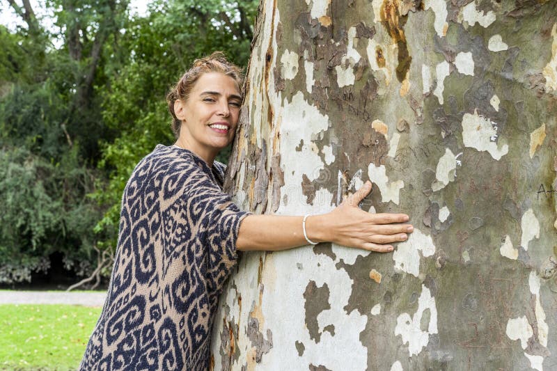 Woman Embracing a Tree in a Serene Park Setting Stock Photo - Image of ...