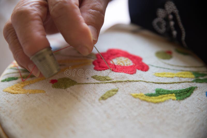 A Woman Embroidering a Handmade Dress. Today, Tailoring Can Be Called ...