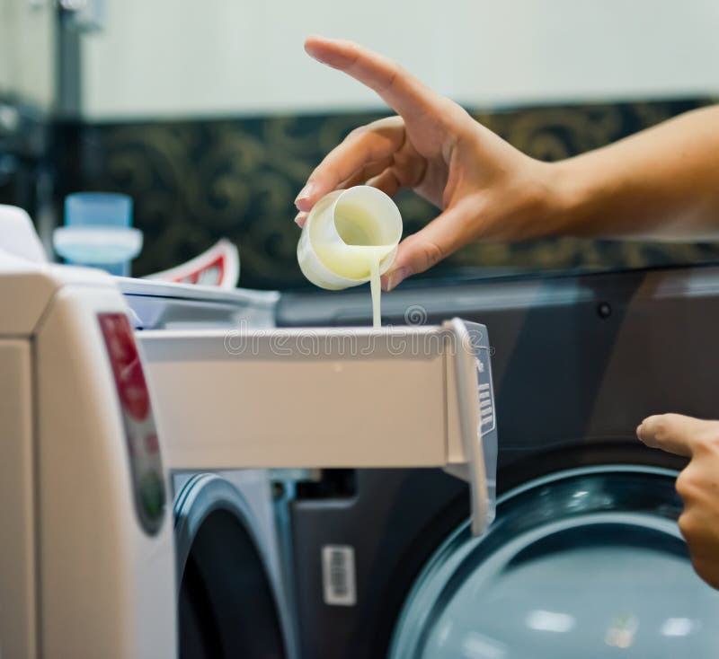 Woman Employee Pouring Detergent in Washer Stock Photo - Image of ...