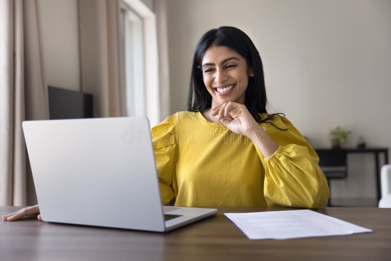 Woman Engaged in Tasks Completion Seated at Desk with Laptop Stock ...