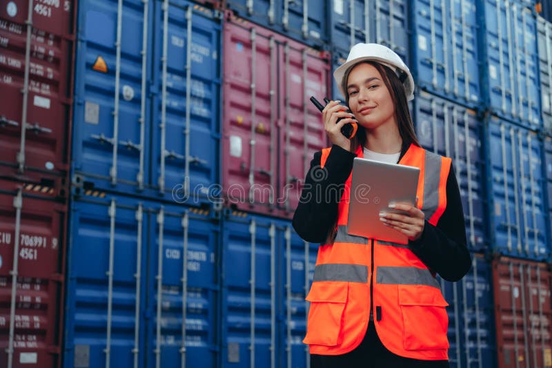 Woman Engineer, Using a Communication Radio and Working in Shipment ...