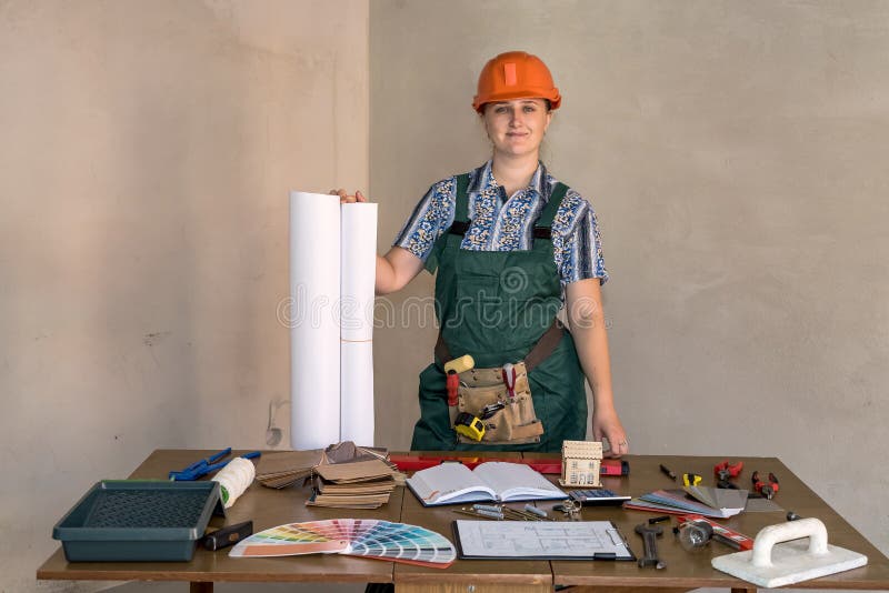 Woman Engineer at Working Place with Blueprints Stock Photo - Image of ...