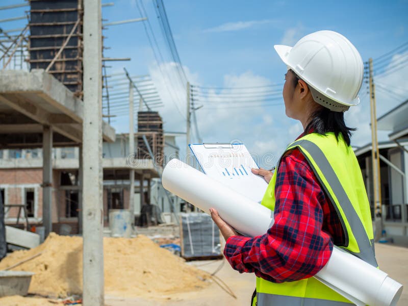 Woman Engineer Working at Site of a Large Building Project, Foreman ...