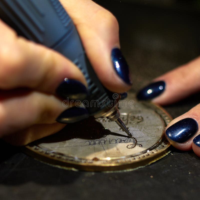Woman engraver at work. stock image. Image of classic - 150822317