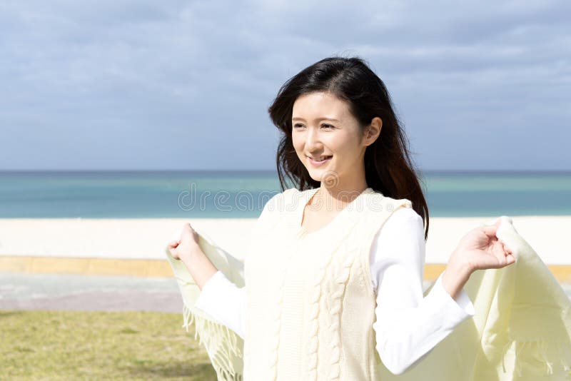 Woman enjoy the sun. stock photo. Image of coast, ocean - 110250072