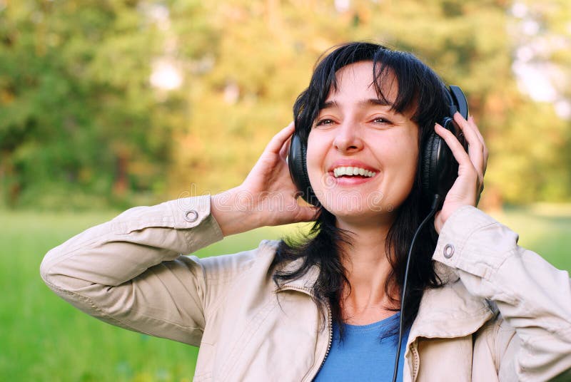 Woman Enjoyes the Music Outdoors Stock Image - Image of enjoy, portrait ...