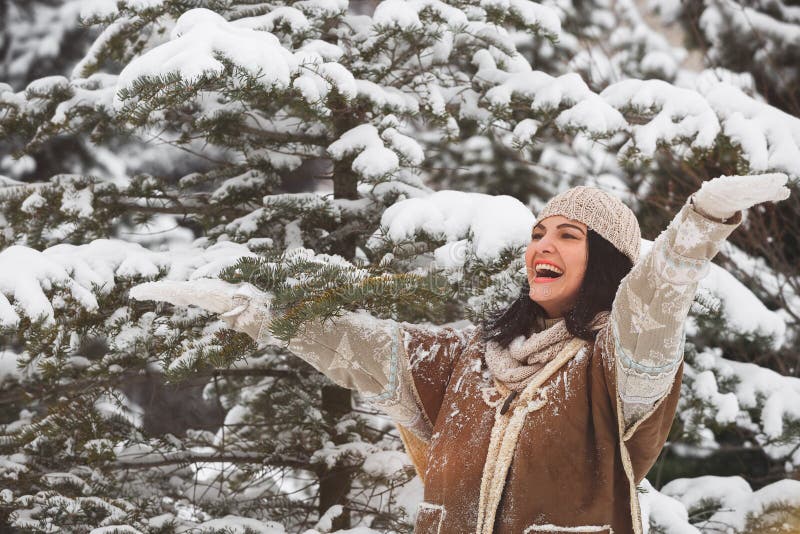Woman Enjoying the Falling Snow Stock Image - Image of outdoor, nature ...
