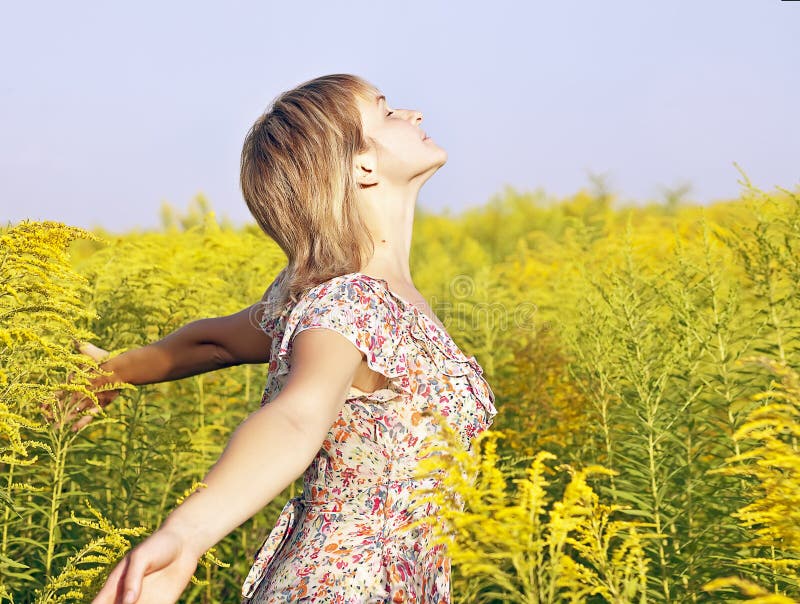 Woman Enjoying the sun stock image. Image of blonde, affirmative - 25994477