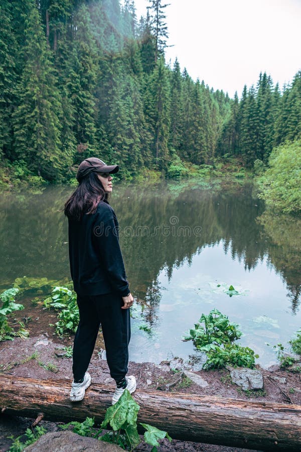 Woman Enjoying View of Wild Lake in Mountains Stock Image - Image of ...