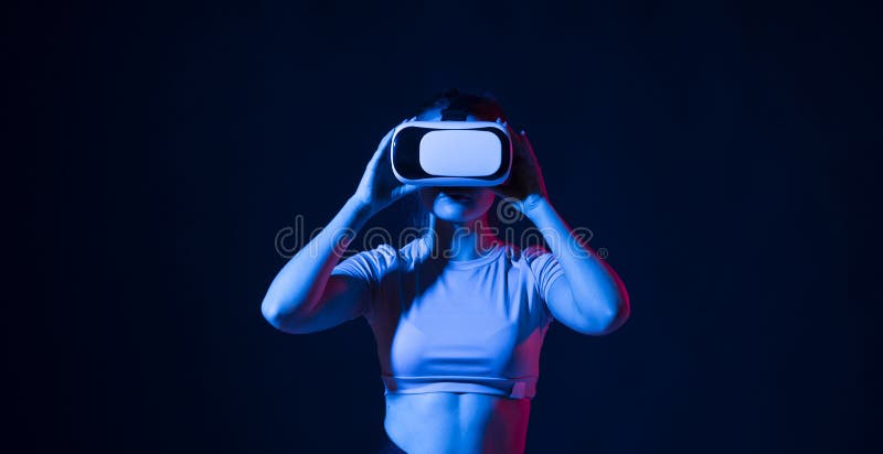 Woman Enjoying a VR Experience. Woman with VR Headset Touching ...
