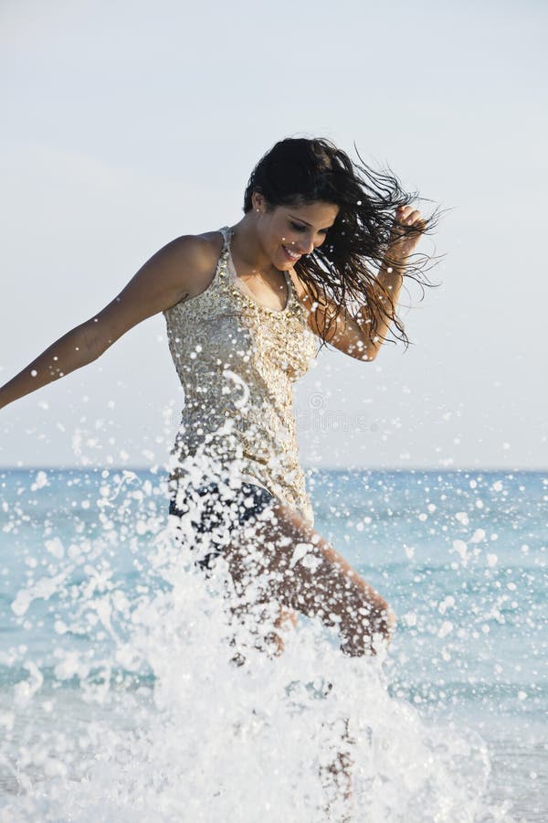 Woman Enjoying in Water on the Beach Stock Photo - Image of hispanic ...