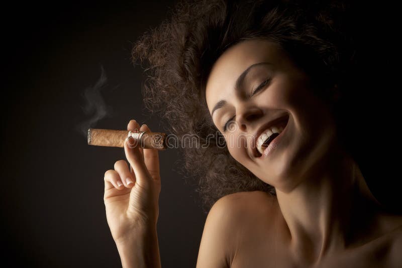 Woman enjoys cigar smoking stock photo. Image of enjoy - 15901212