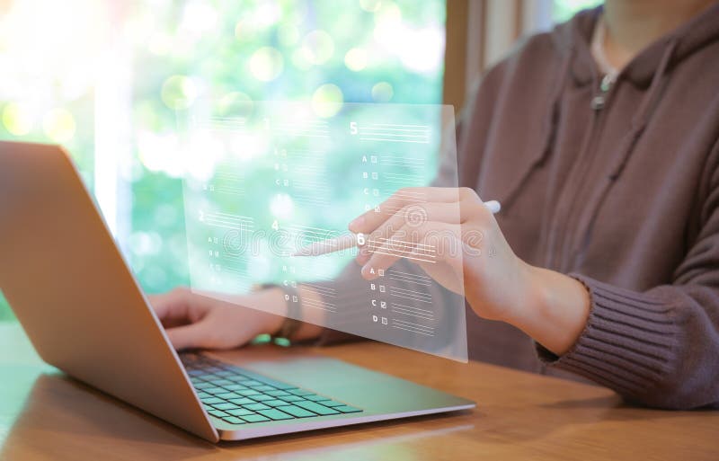 Woman Evaluating Questionnaire on Laptop Computer on Internet Website ... Woman Evaluating Questionnaire on Laptop Computer on Internet Website ...