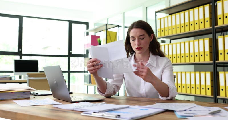 Woman Examines Work Papers with Frustrated Expression Stock Video ...