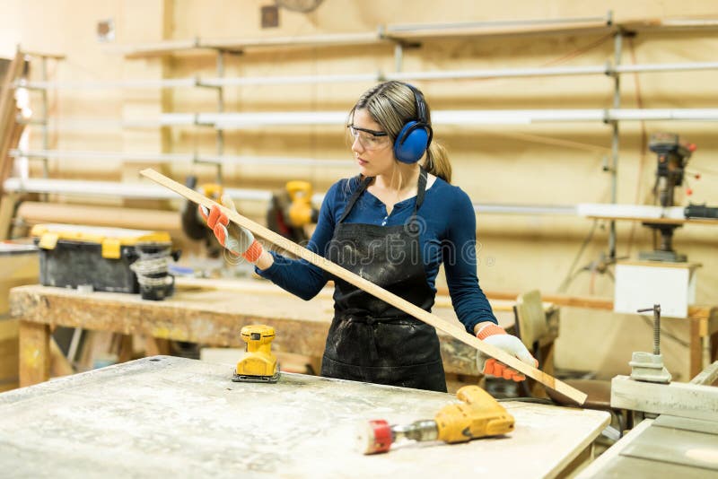 Woman Examining Some Wood at Work Stock Image - Image of craft, latin ...