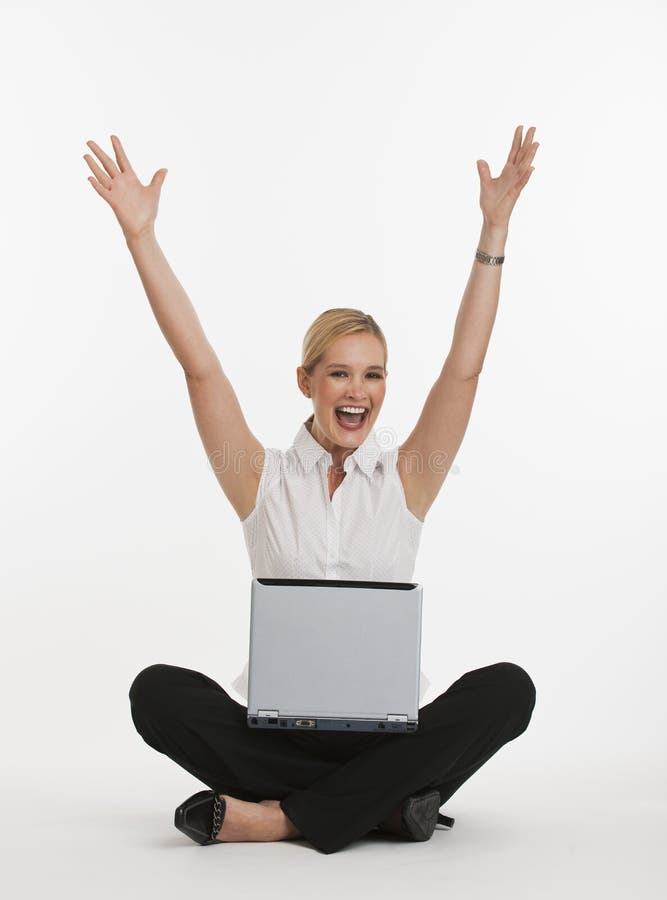 Excited Young Woman Running and Typing at a Laptop Computer Stock Photo ...