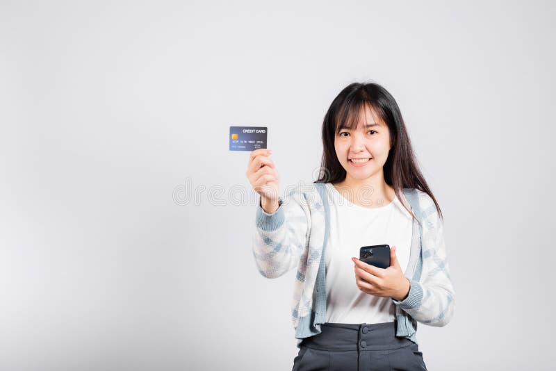 Woman Excited Smiling Hold Mobile Phone And Plastic Debit Credit Bank