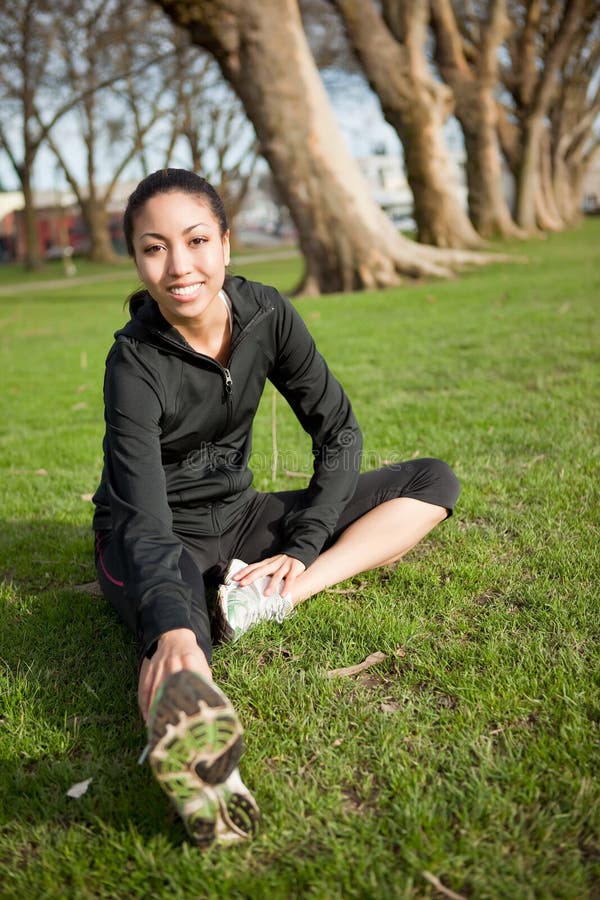 Man and Woman Performing Yoga Exercise - Vertical Stock Photo - Image ...