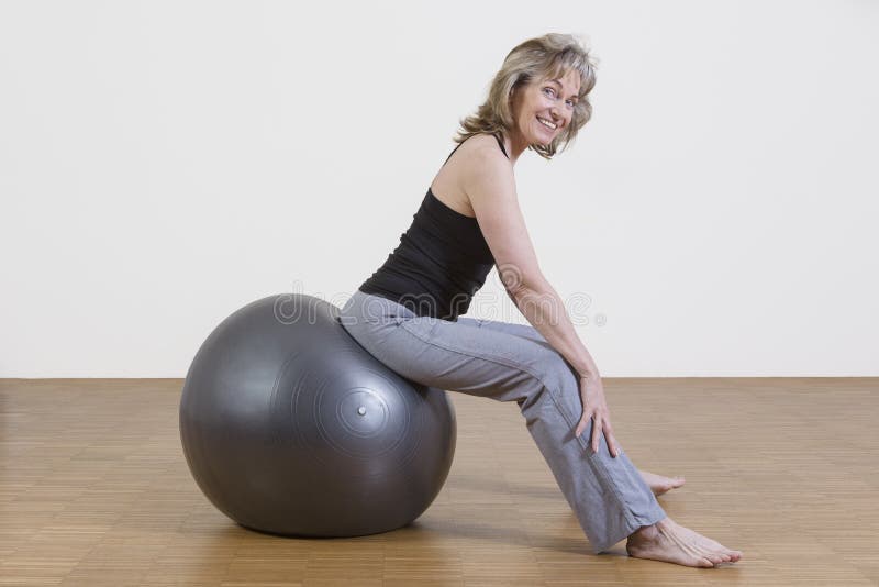 Woman Exercises with Pilates Ball Stock Image - Image of back, happy ...