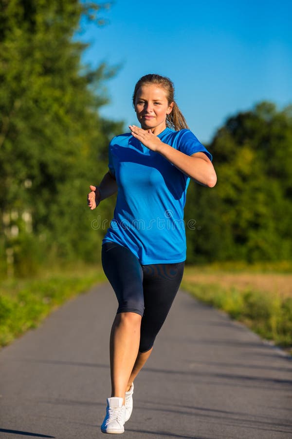 Woman exercising stock photo. Image of jogging, enjoymant - 65676832