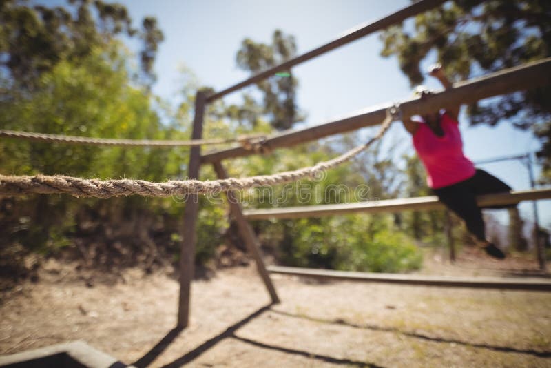 Woman Exercising on Outdoor Equipment during Obstacle Course Stock ...