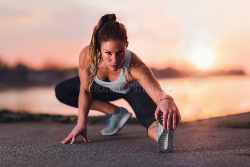 Woman Stretching by the Water Stock Photo - Image of power, lifestyle ...