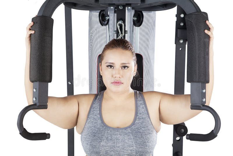 Woman Exercising on a Shoulder Press Machine Stock Photo - Image of ...