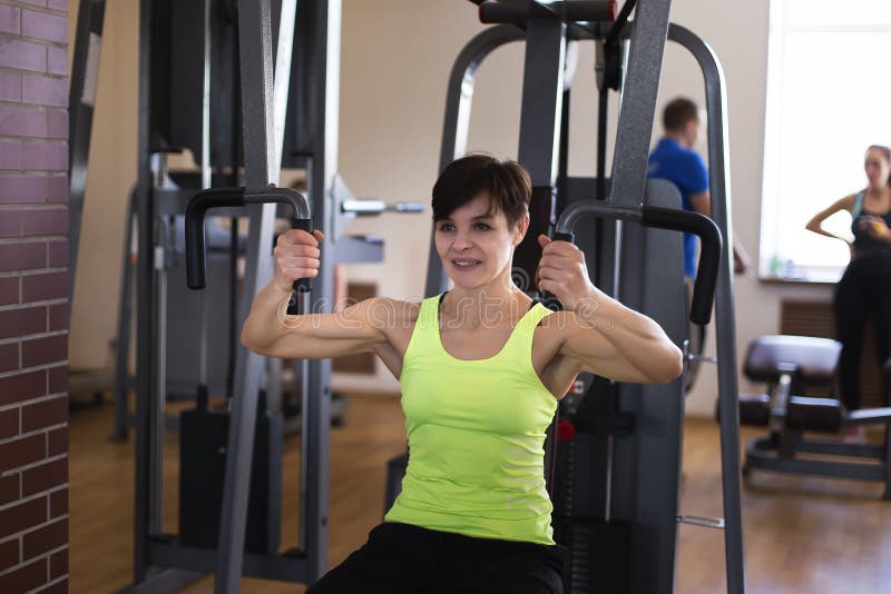 Woman Exercising on the Simulator Doing Strength Exercises Stock Image ...