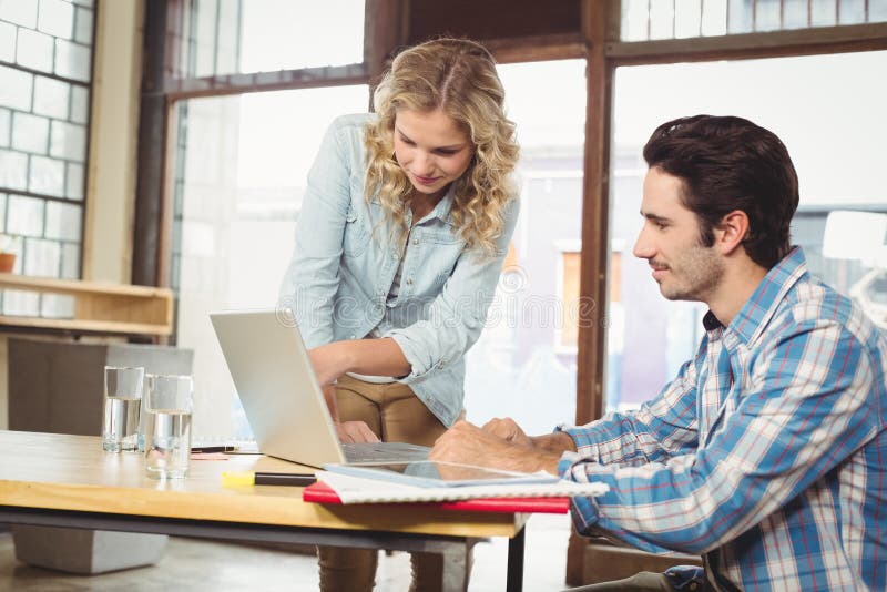 Woman Explaining Colleague in Office Stock Photo - Image of ...