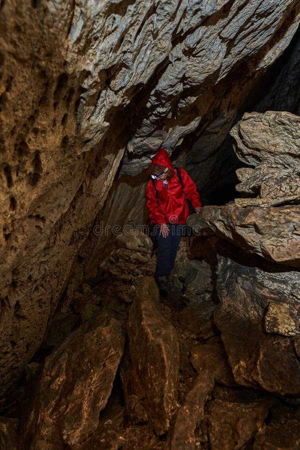 Woman explorer in a cave stock photo. Image of naturalist - 252875346